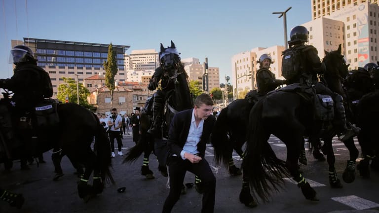 Ultra-orthodox protesters block roads and trains across Israel over ...