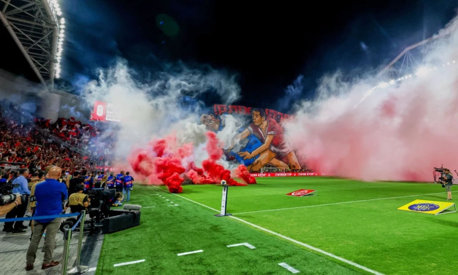 Israeli soccer game abandoned after rioting rival fans throw flares and ...