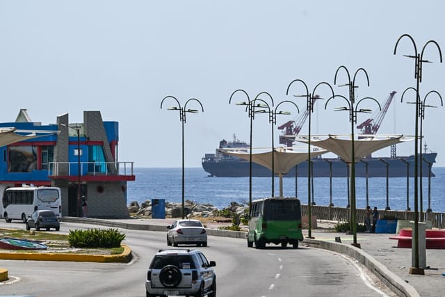 Two Venezuela military planes fly over US ships as tensions rise