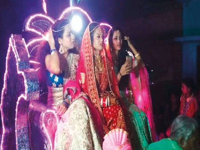 Bride leads wedding procession to groom’s house